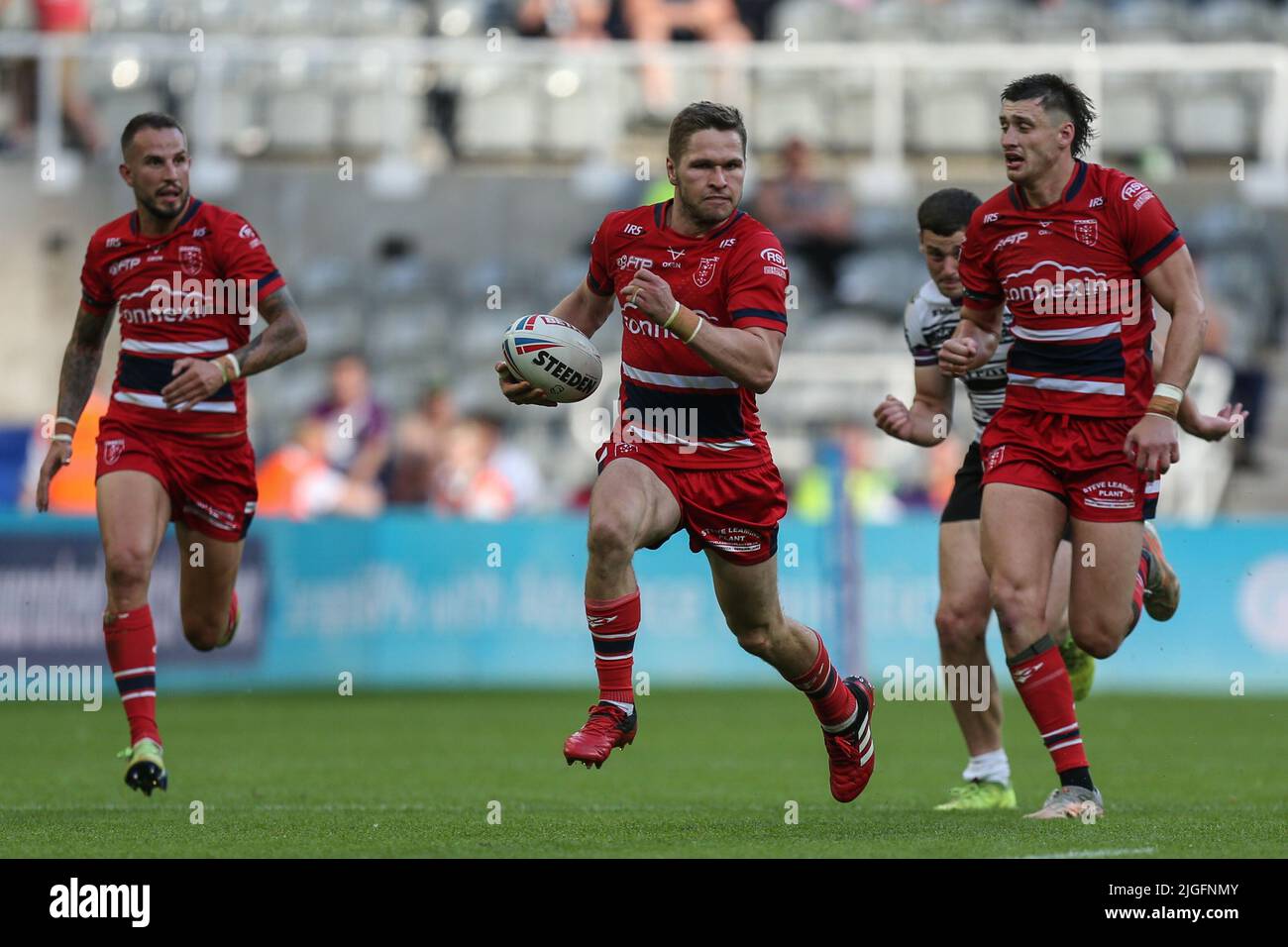 Matt Parcell #9 of Hull KR gets past the Hull FC defence to make a run ...
