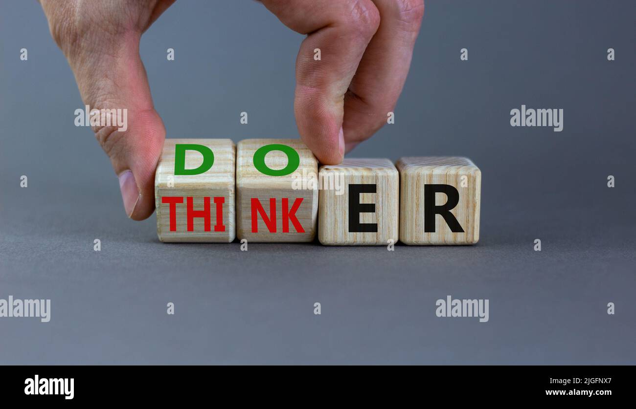Doer or thinker symbol. Concept words Doer or thinker on wooden cubes ...