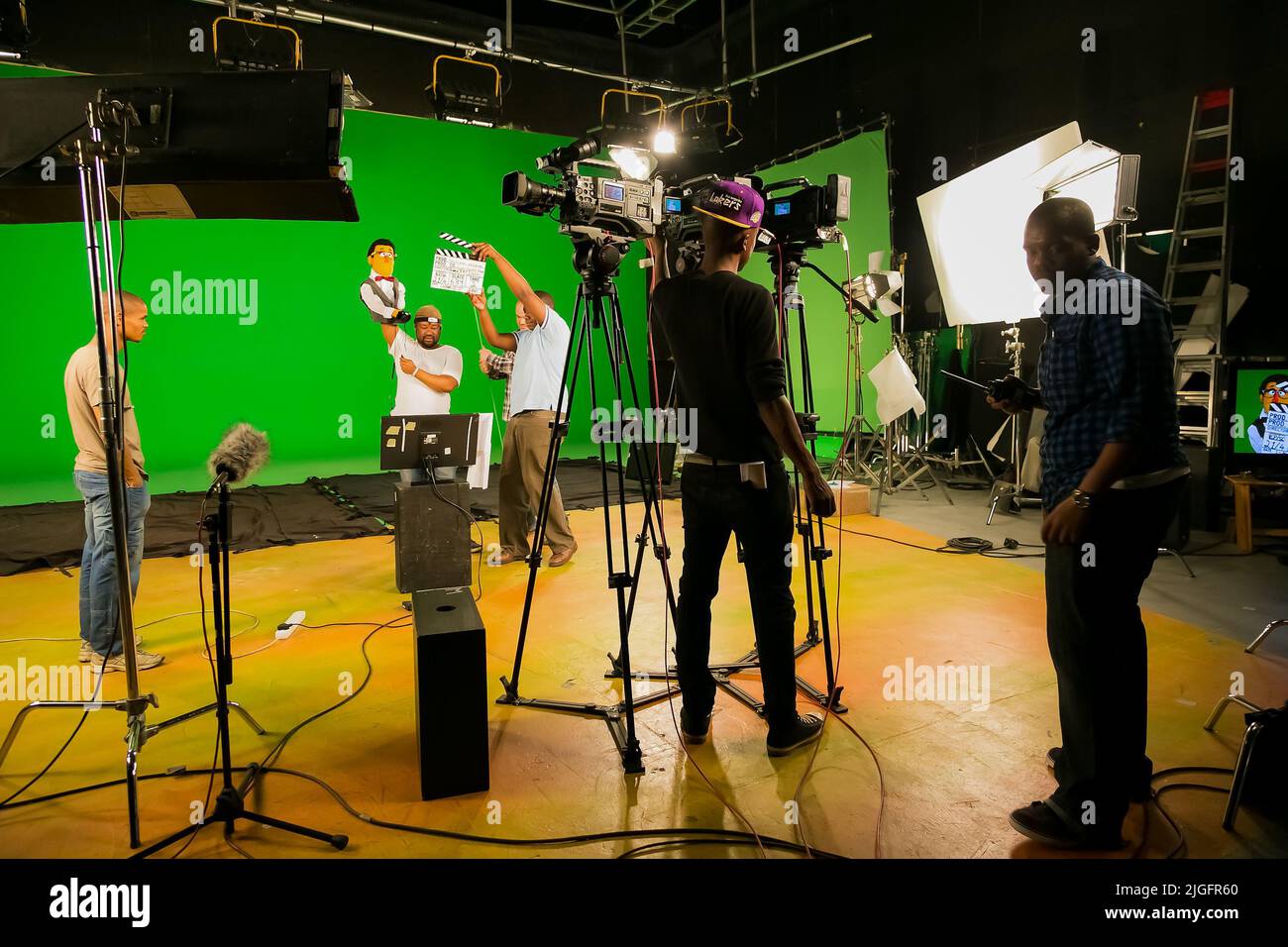 A closeup shot of people during behind the scenes of children's TV ...