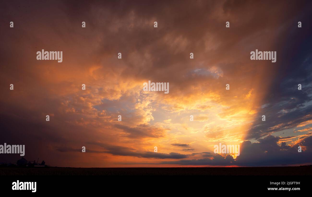 Bright sunset, with orange sun rays. Landscape Stock Photo - Alamy