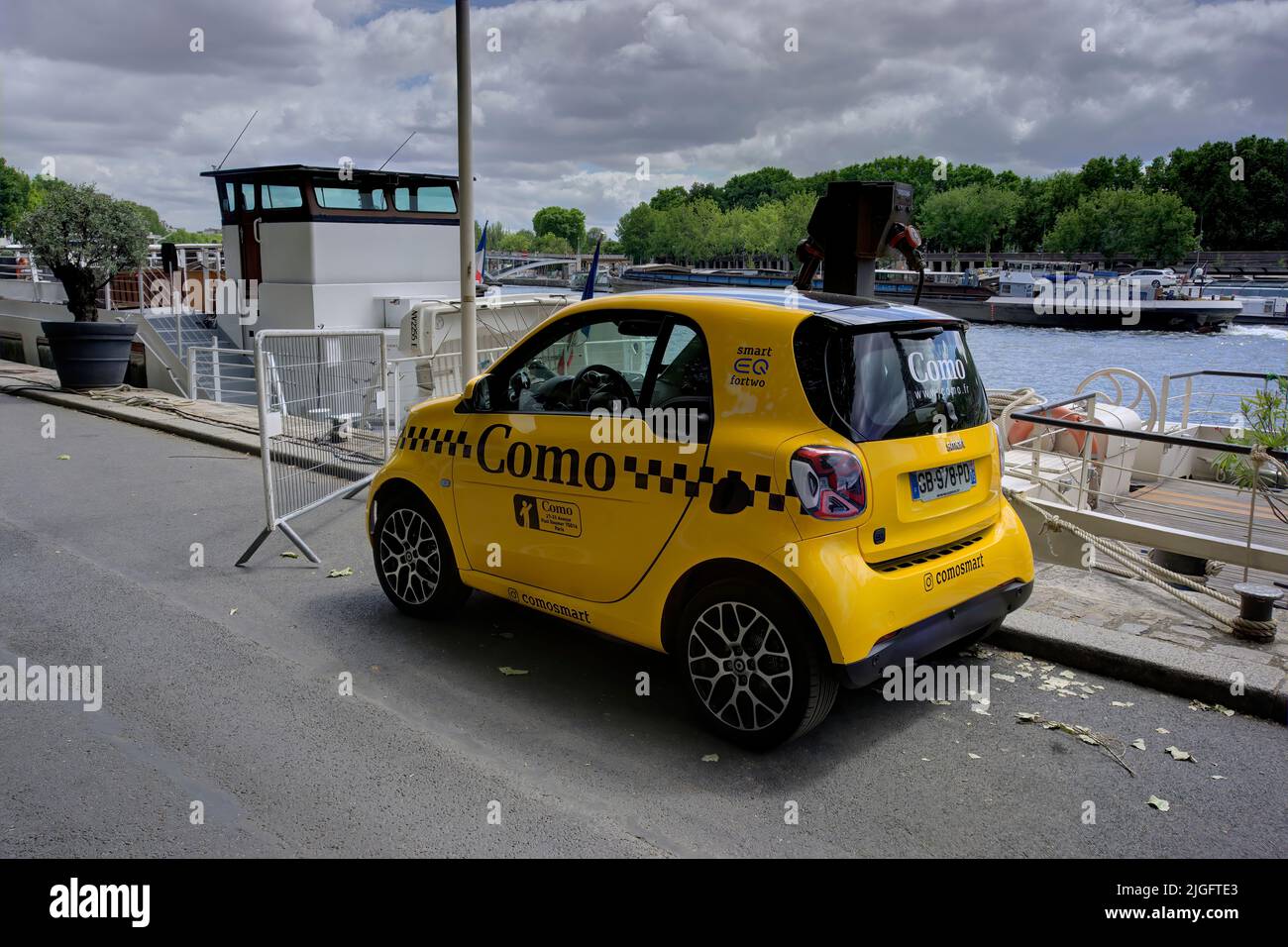 Paris, France - May 26, 2022: Como smart electric car at charging point ...