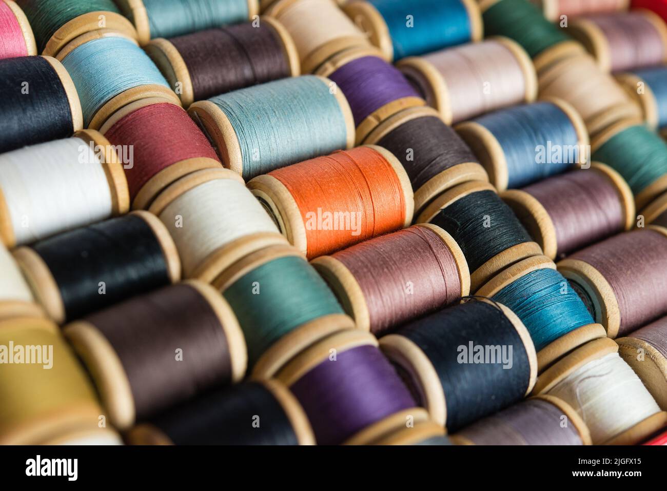 Multi-colored spools of thread close-up Stock Photo - Alamy