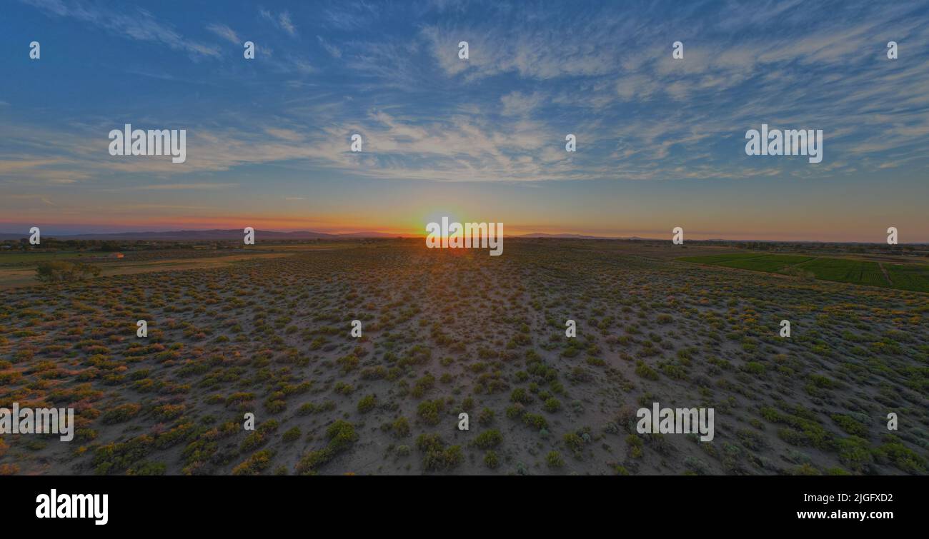 Desert sunset showing of the whole of a small farming town Stock Photo ...