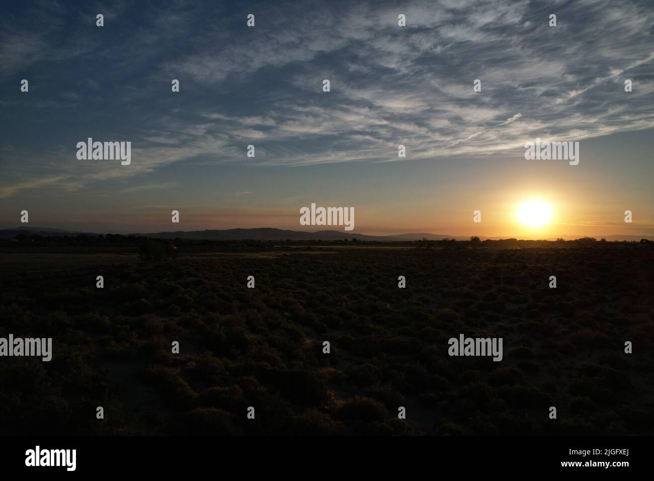 Desert sunset showing of the whole of a small farming town Stock Photo ...