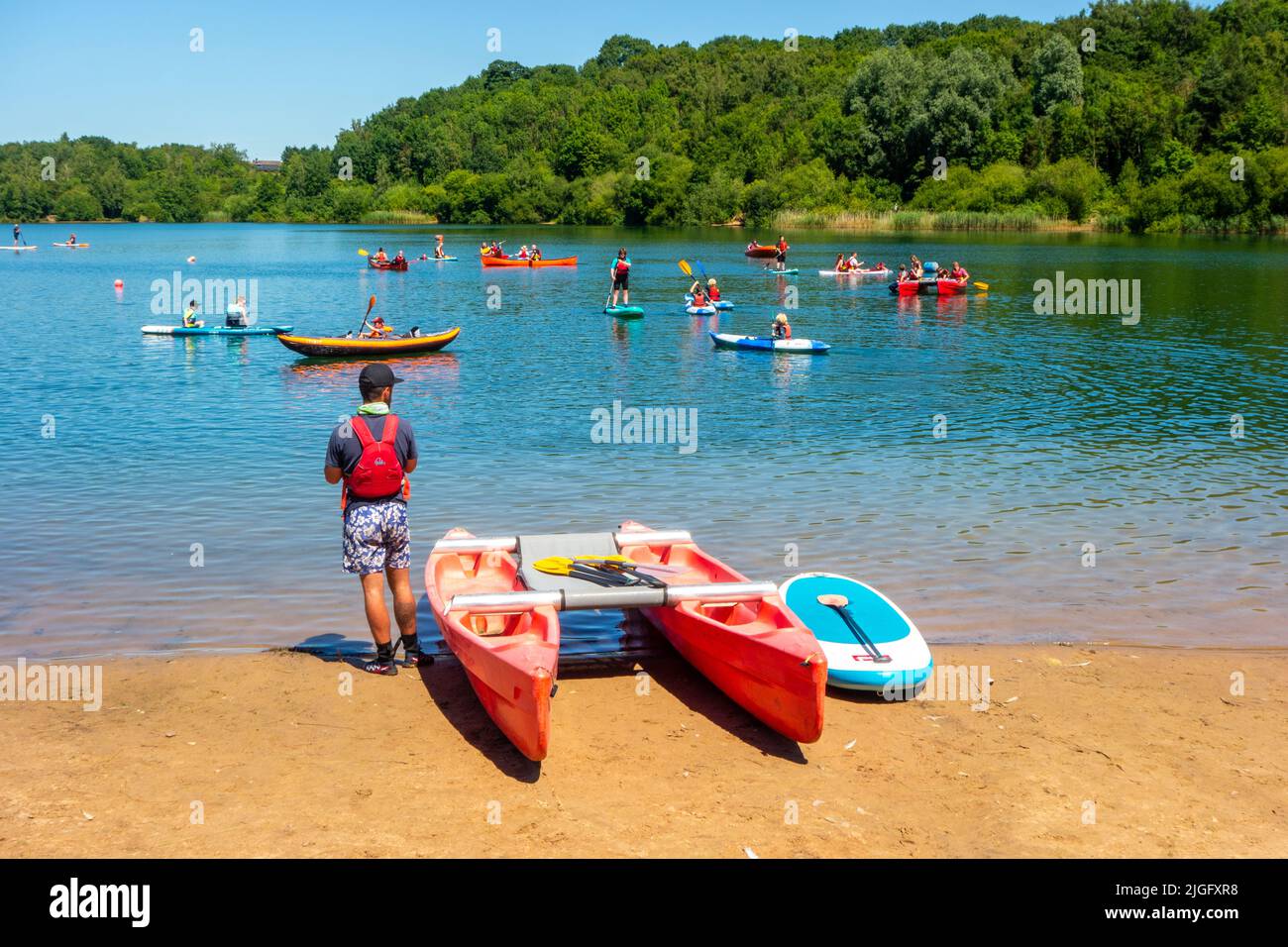 People and families enjoying the summer sunshine at Astbury Mere water ...