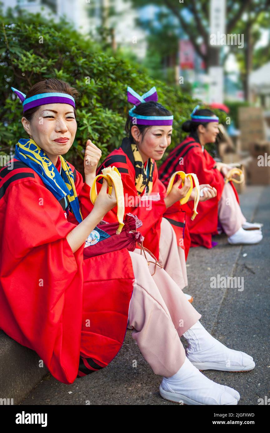 Dancers on break eating a banana at Yosakoi Matsuri, Harajuku, Tokyo ...