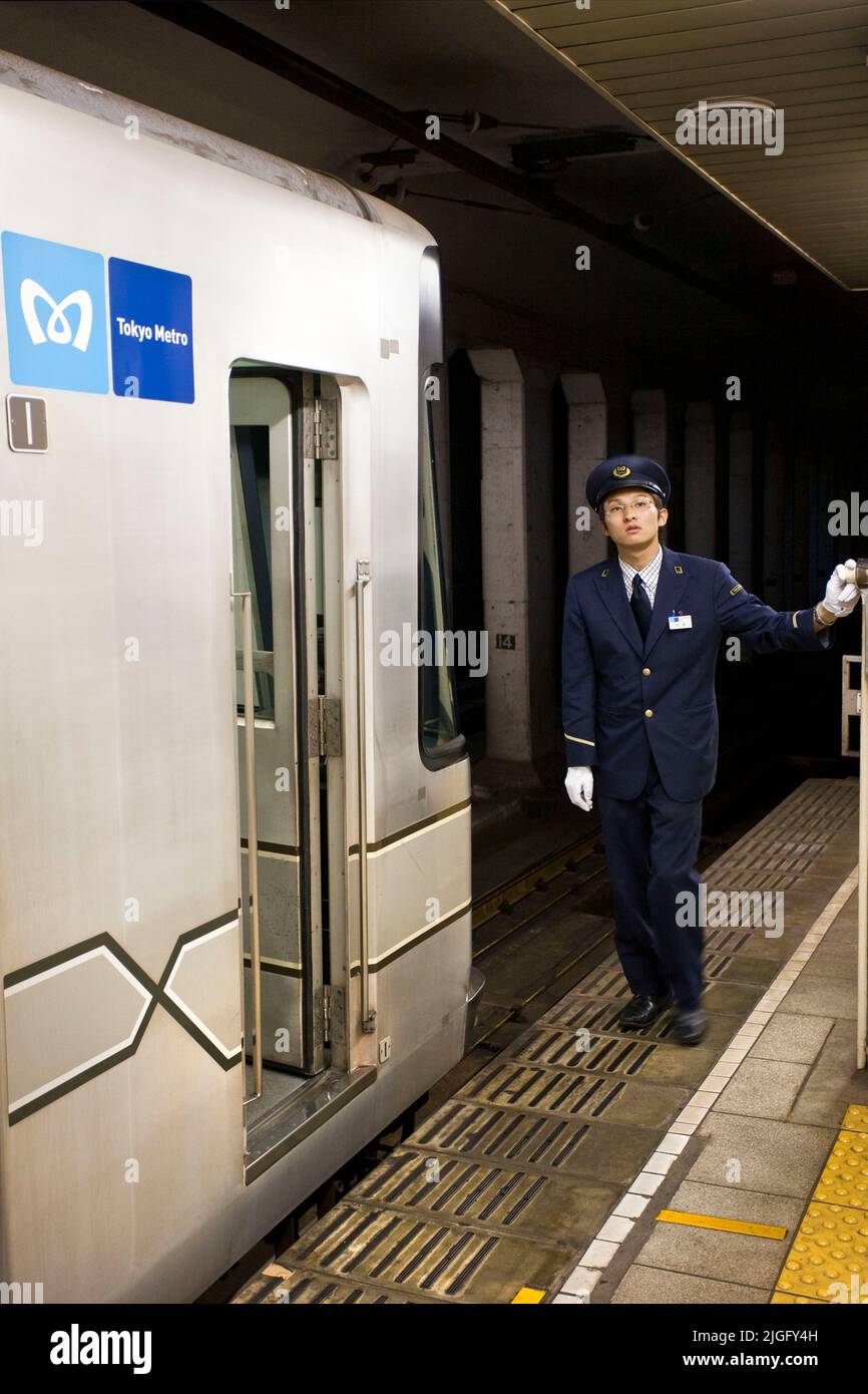 Engineer signals subway to start Tokyo Japan Stock Photo - Alamy