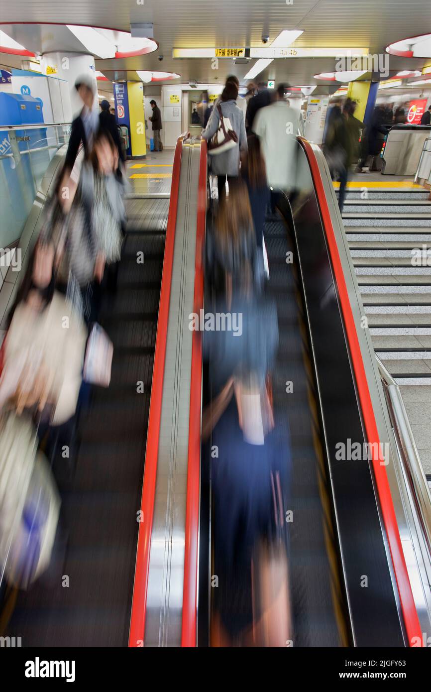 Escalator passenger motion blur Subway station Tokyo Japan 3 Stock Photo - Alamy