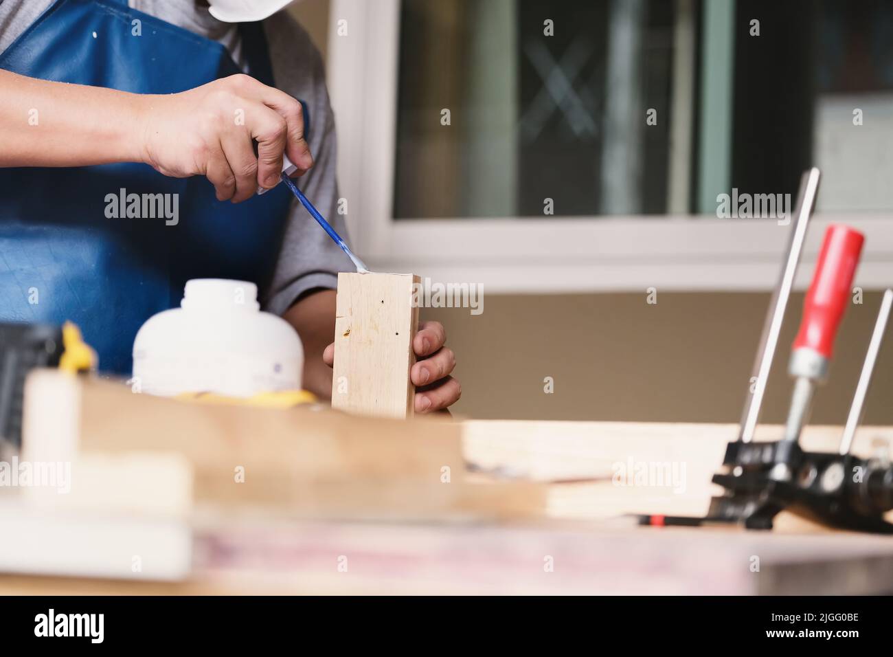 Woodworking operators are using glue to put together the wood parts to ...