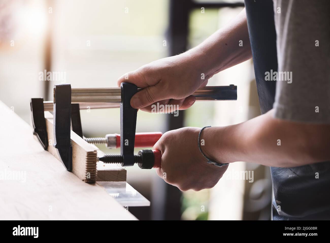 Woodworking operators are decorating pieces of wood to assemble and ...