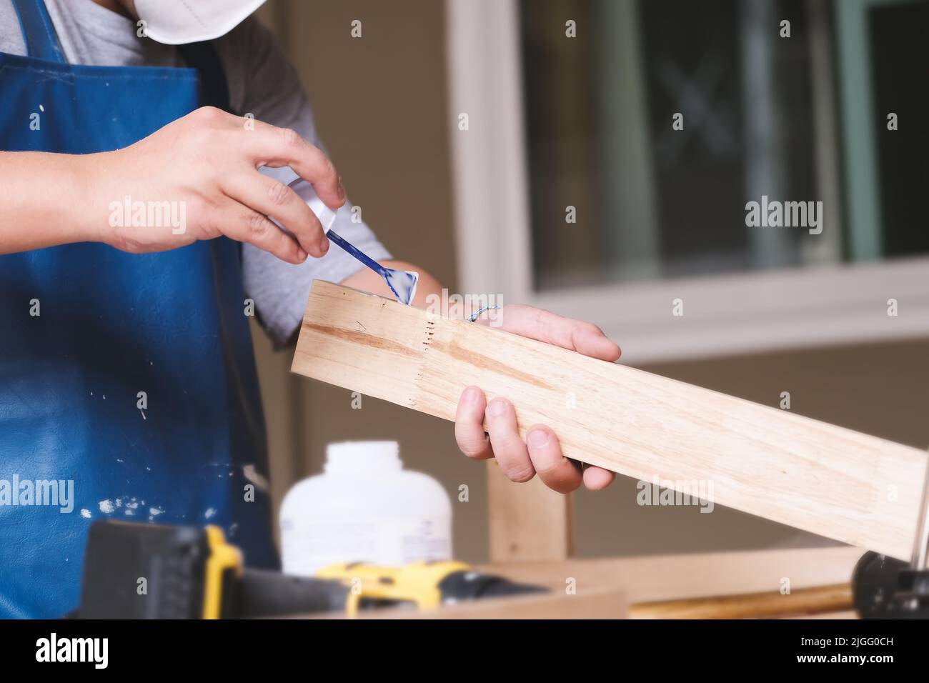 Woodworking operators are using glue to put together the wood parts to ...