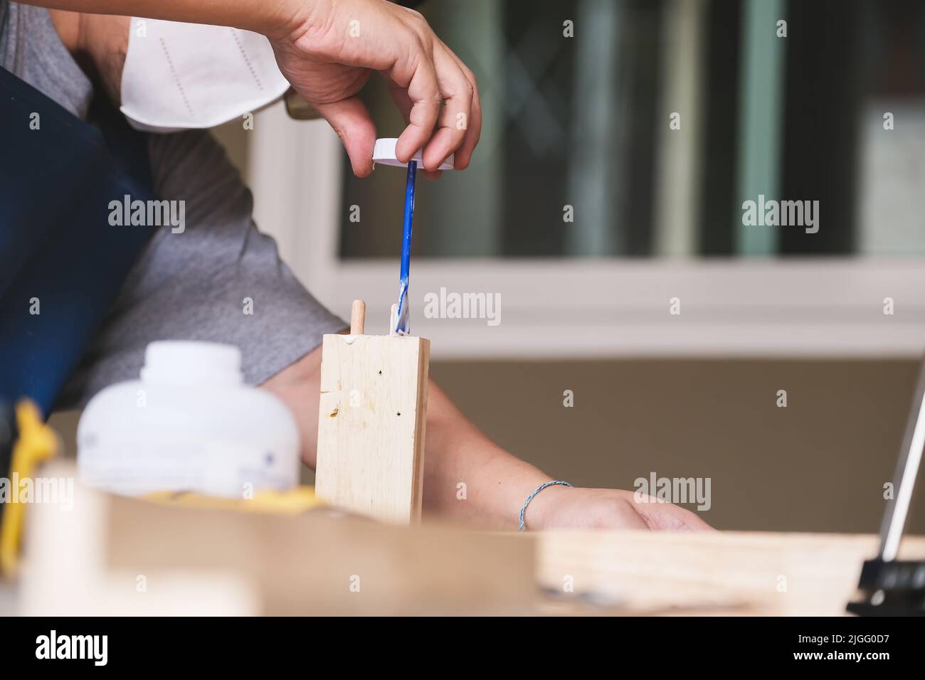 Woodworking operators are using glue to put together the wood parts to ...
