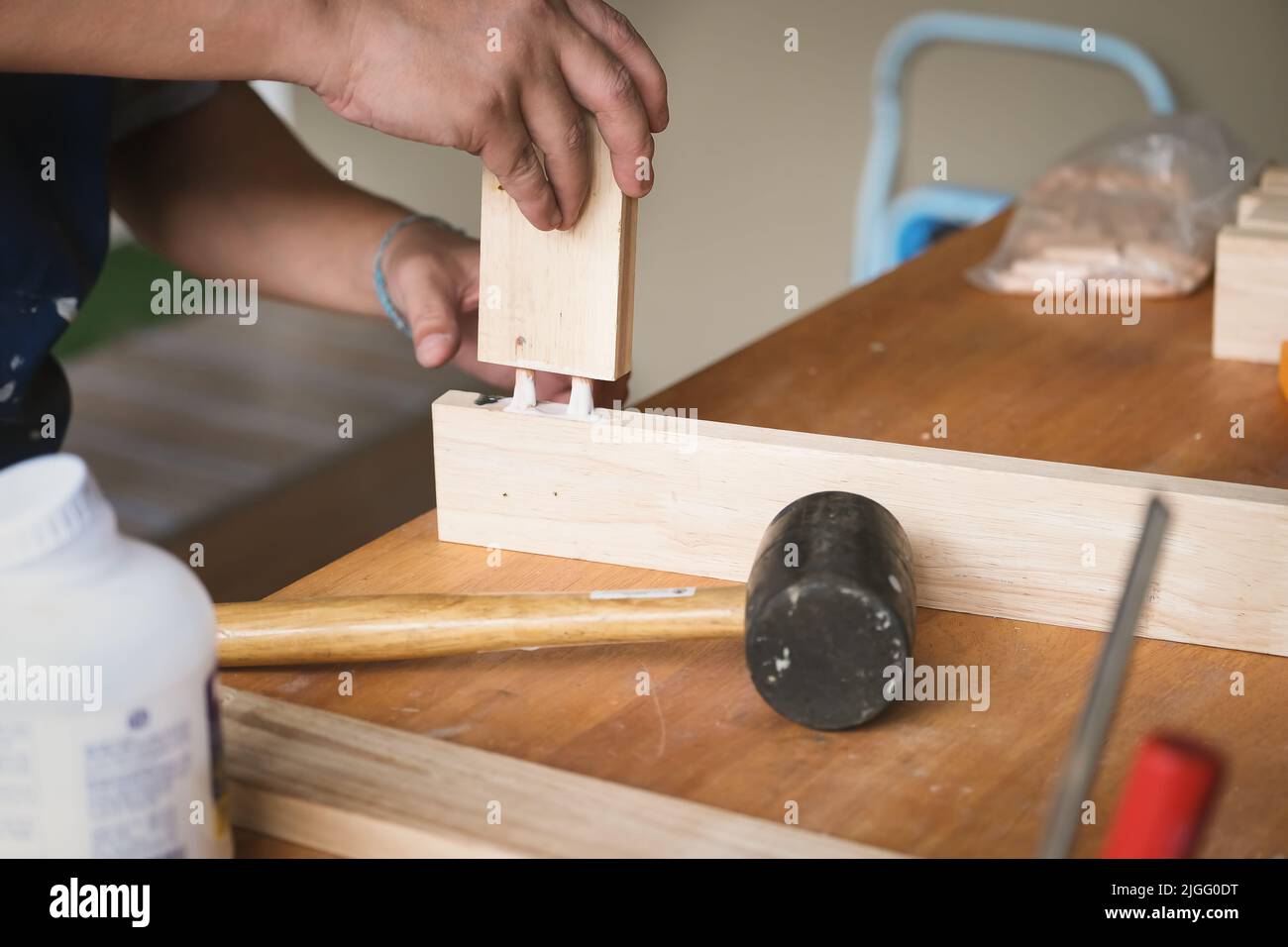Woodworking operators are using glue to put together the wood parts to ...