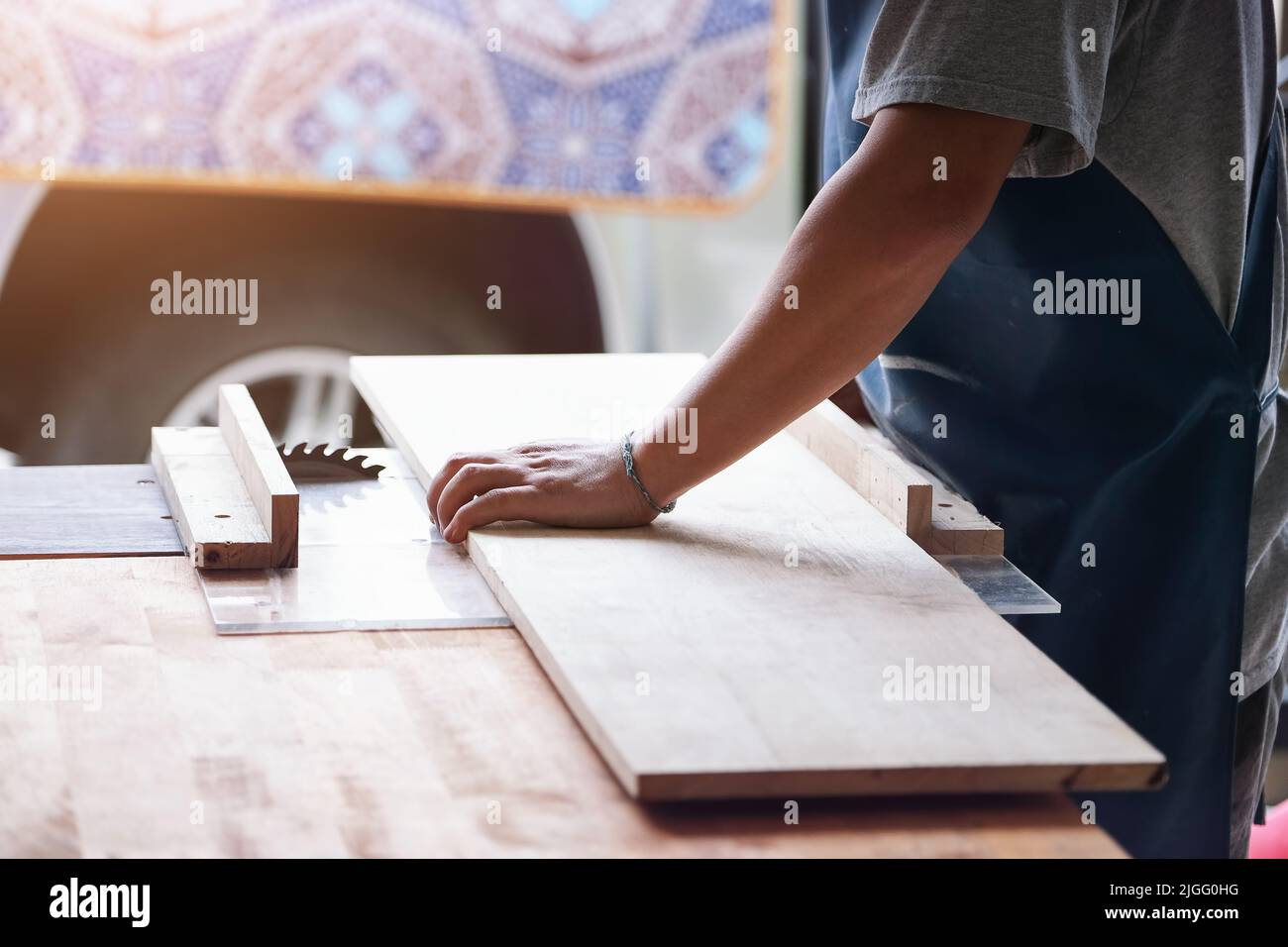 Woodworking operators are using plank cutting machines to assemble and ...