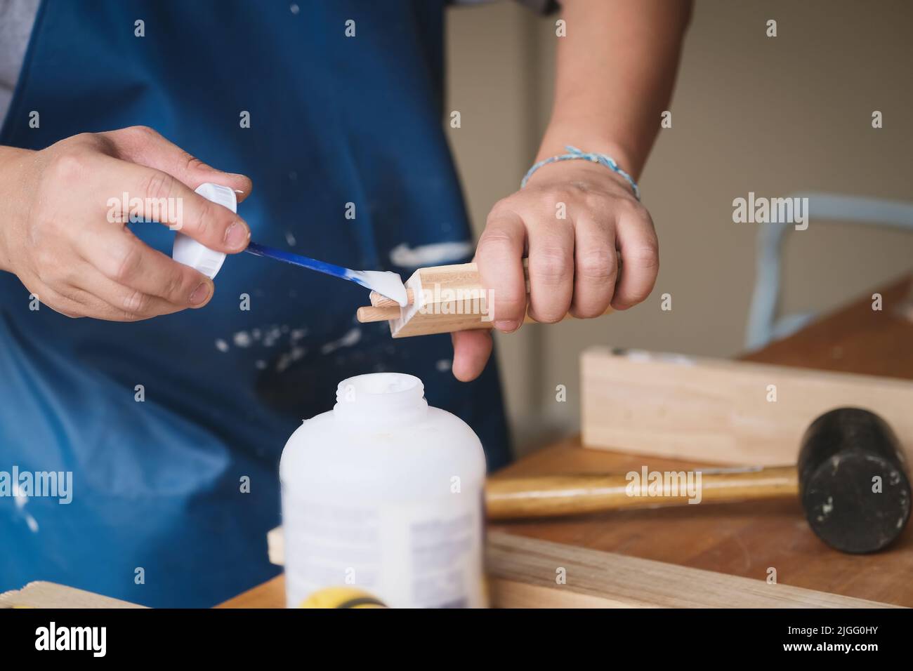 Woodworking operators are using glue to put together the wood parts to ...