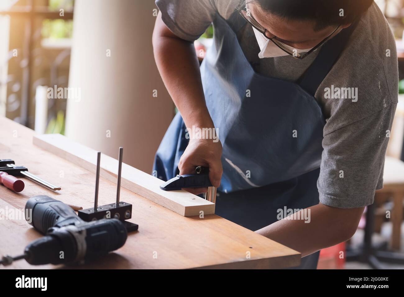 Woodworking operators are decorating pieces of wood to assemble and ...