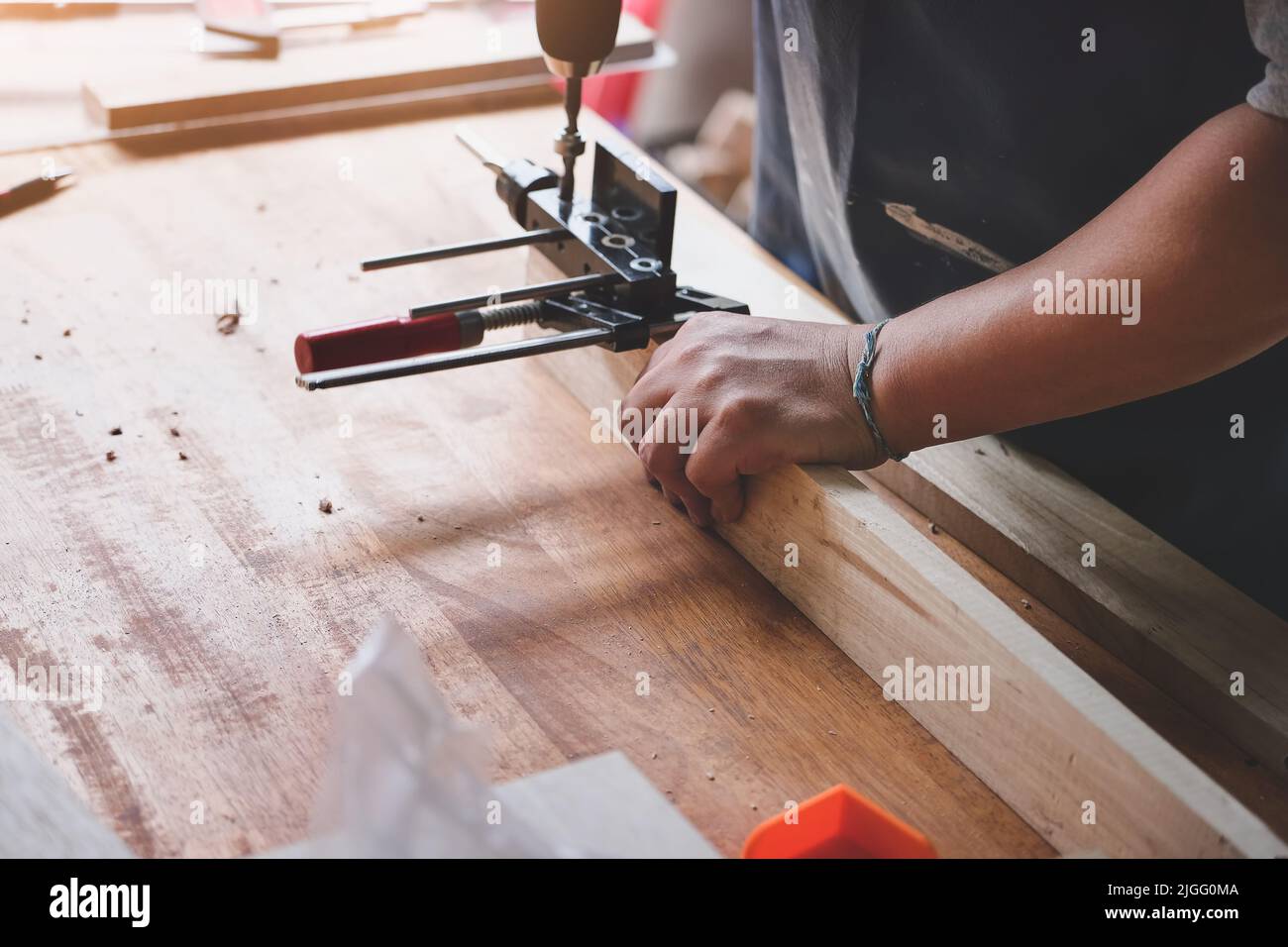 focus hand holding the wood handle, Woodworking operators are using a ...