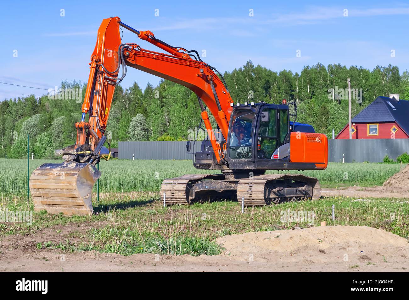 Crawler excavato front view digging a sewer trench Stock Photo - Alamy