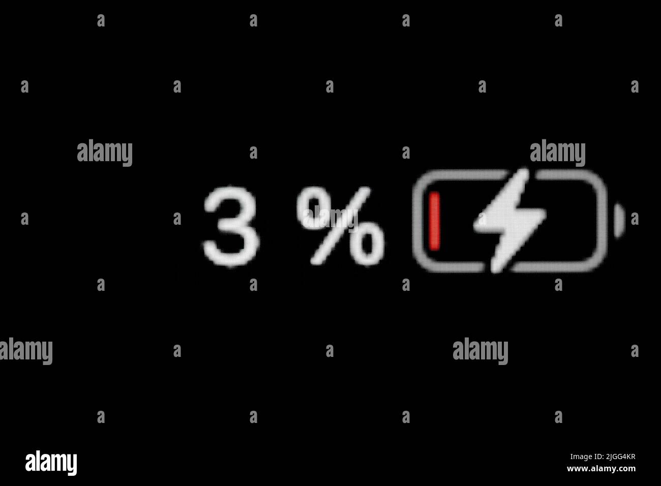 Smartphone charged battery level indicator - three, 3 percent: close up ...