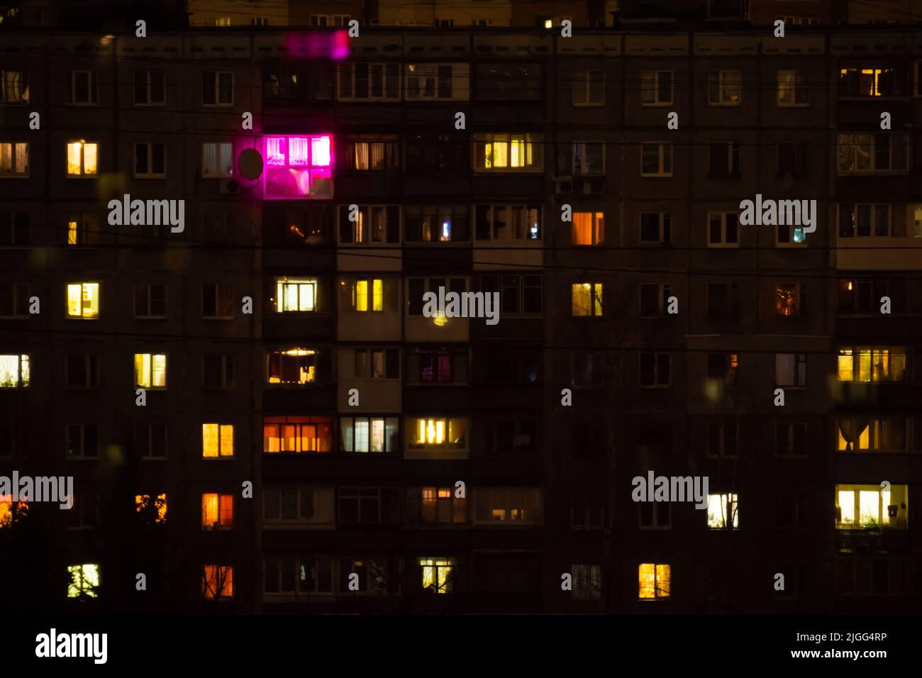 Dark apartment building lit window hi-res stock photography and images ...