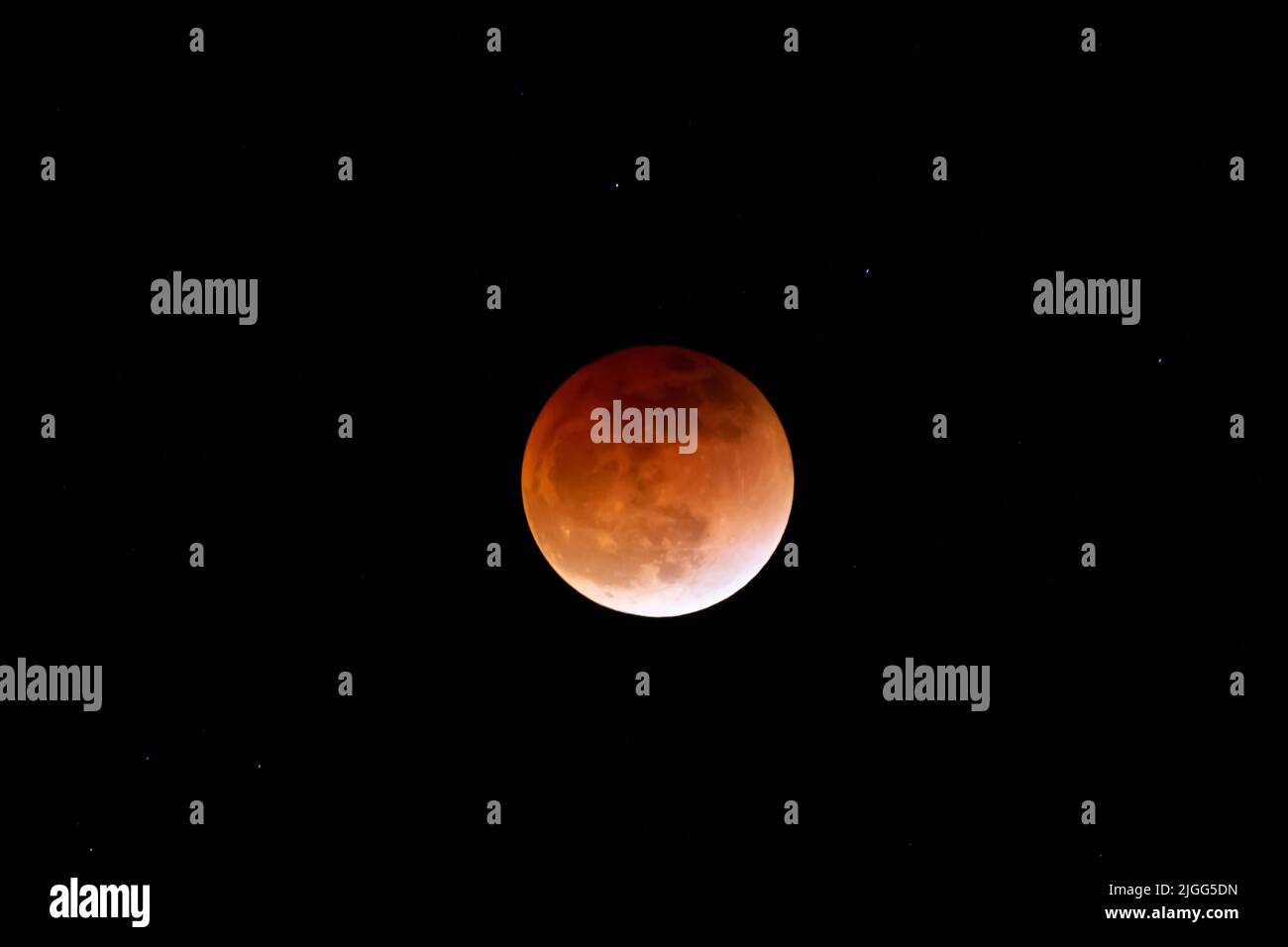 A striking partial eclipse of the moon and star pattern over California ...