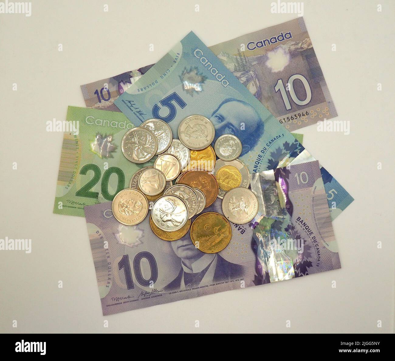 Canadian banknotes and coins, CAD, Canada, North America Stock Photo ...