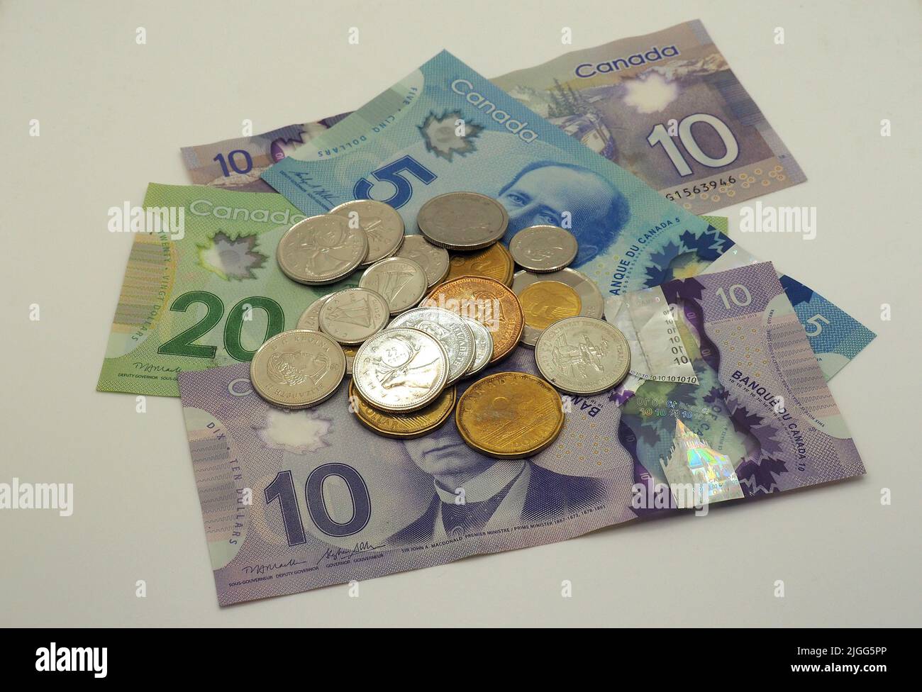 Canadian banknotes and coins, CAD, Canada, North America Stock Photo ...