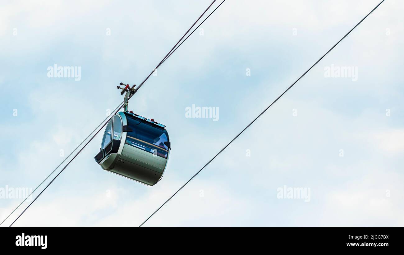 Moddern cable car cabin on blue sky background. Ropeway gondola close ...