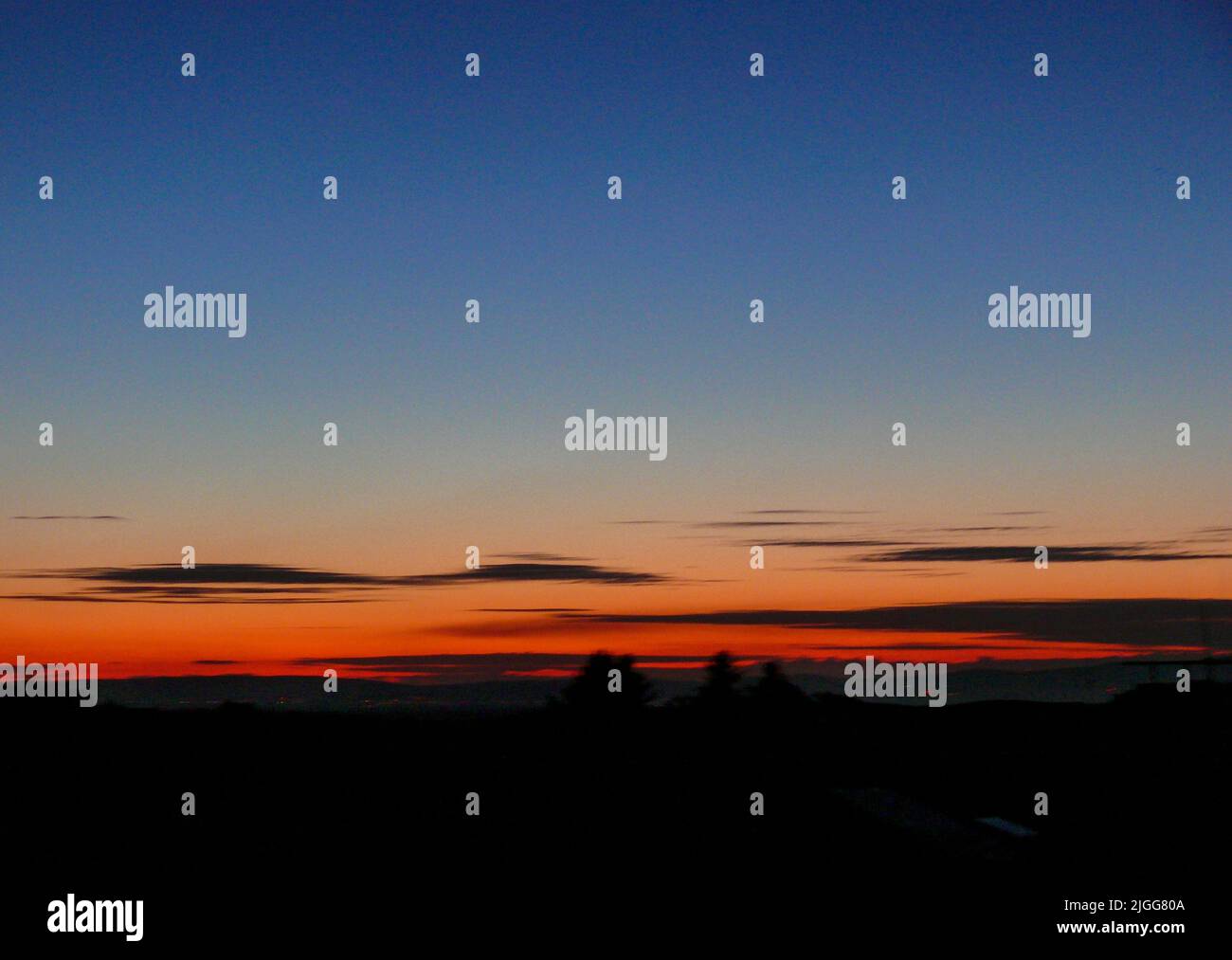 The sky at sunset and last-light silhouettes Stock Photo - Alamy