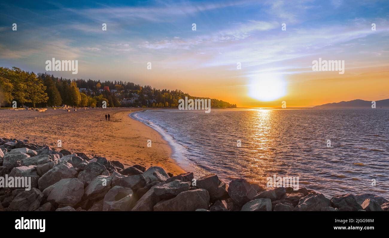 Spanish Bank beach in Vancouver (BC, Canada) at sunset, with sihouette ...