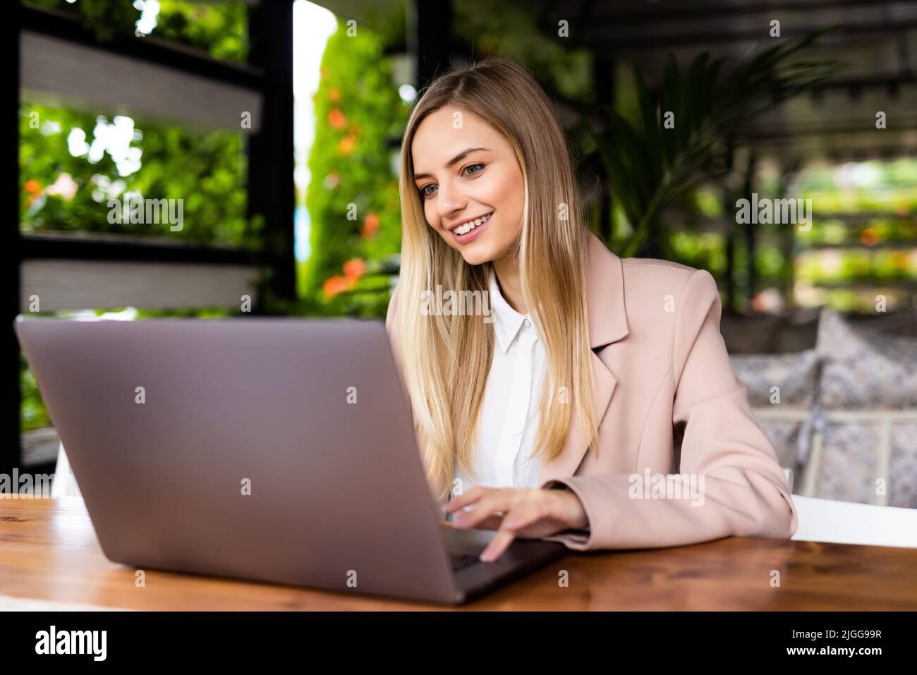 Beautiful woman at the cafe with a laptop having a coffee break Stock ...