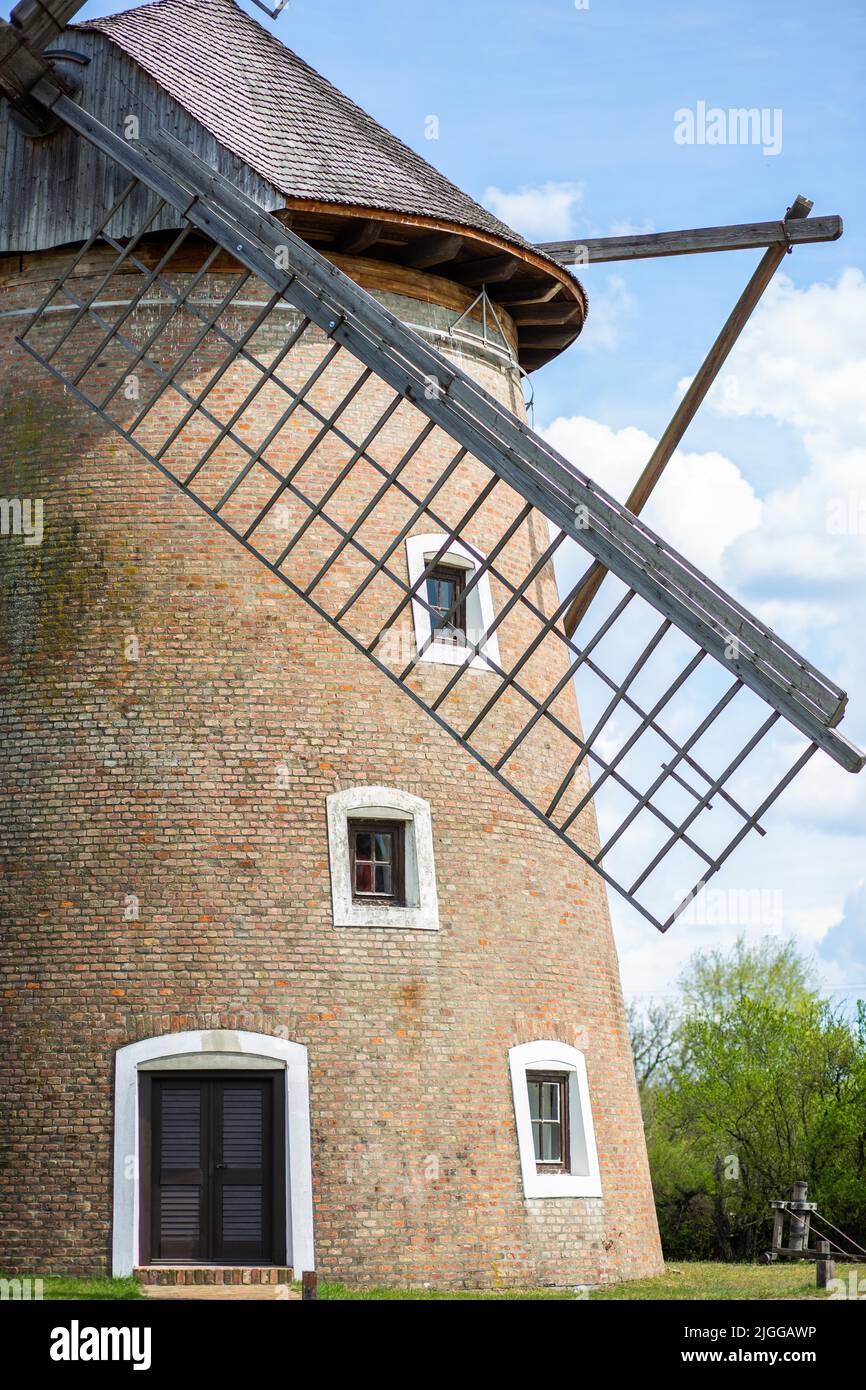 A vertical shot of a brick windmill in Opusztaszer village, Hungary ...