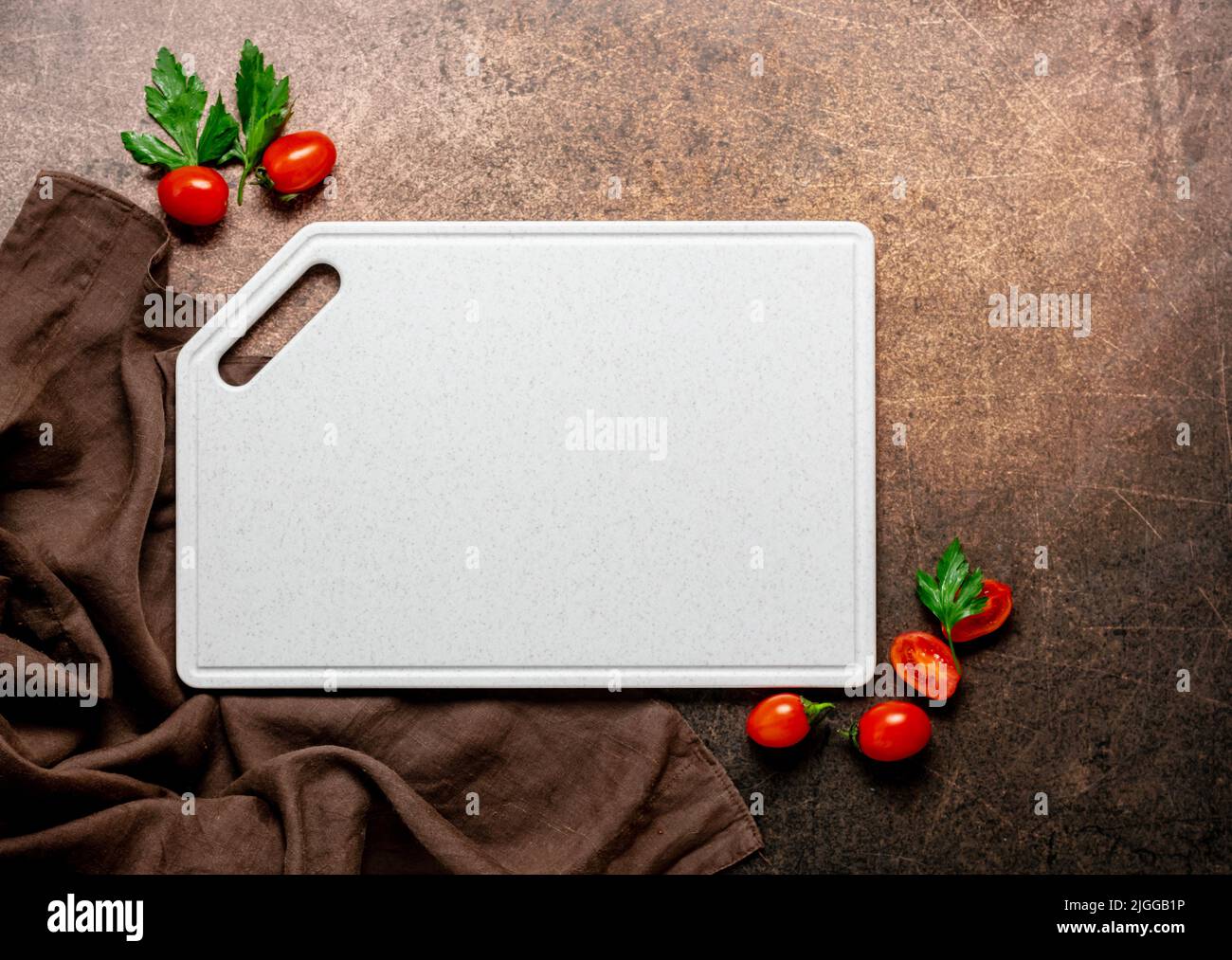 Marble white cutting board ripe spice cherry tomatoes on aged brown ...