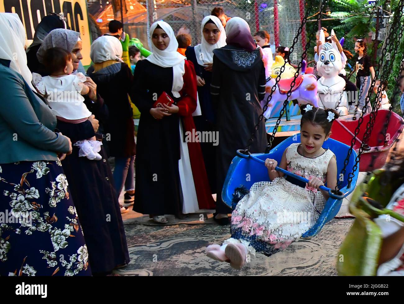 Damascus, Syria. 10th July, 2022. People spend time at a theme park ...