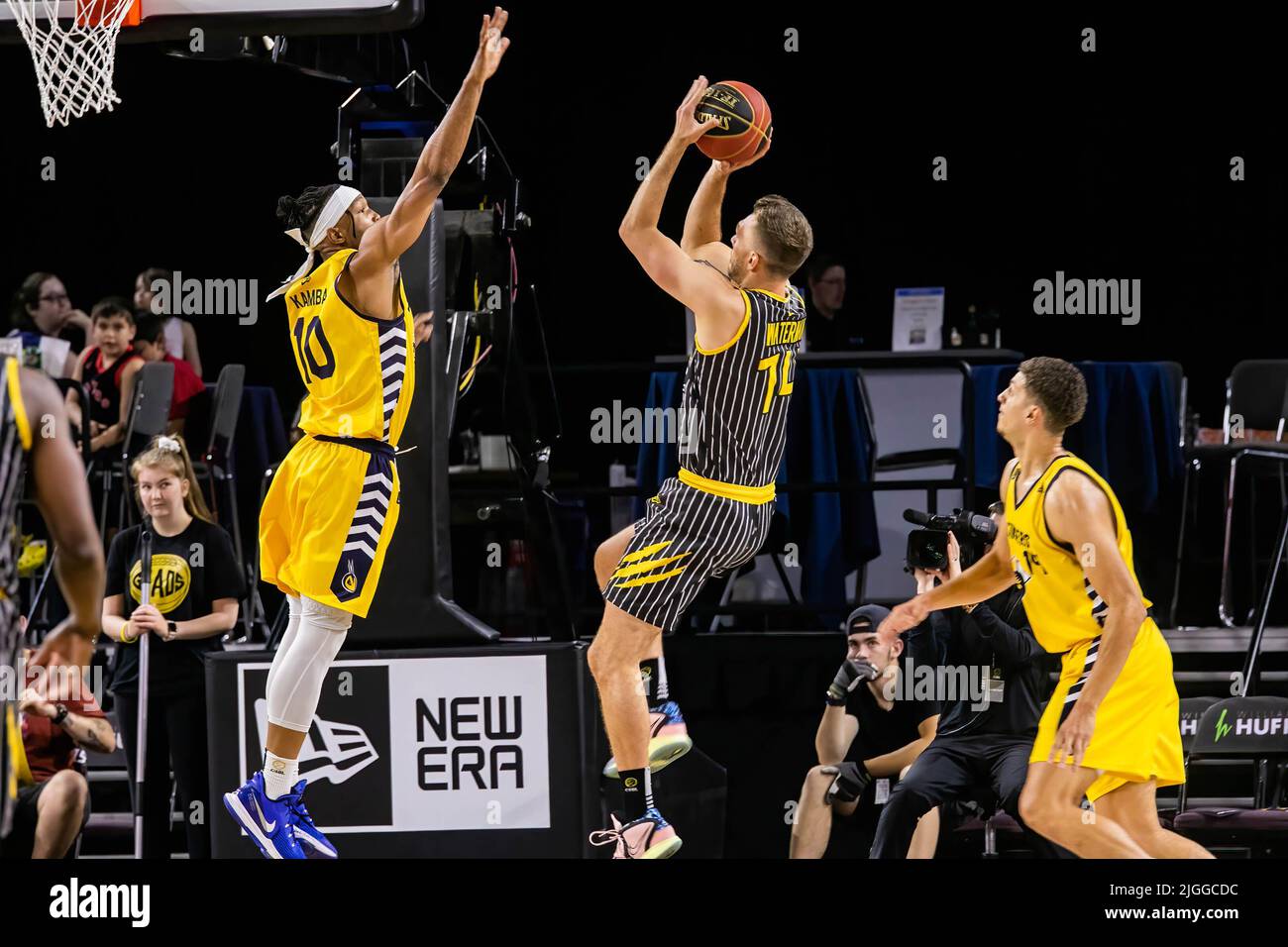 Edmonton's #10 Mathieu Kamba (guard) defends against Hamilton's #14 ...