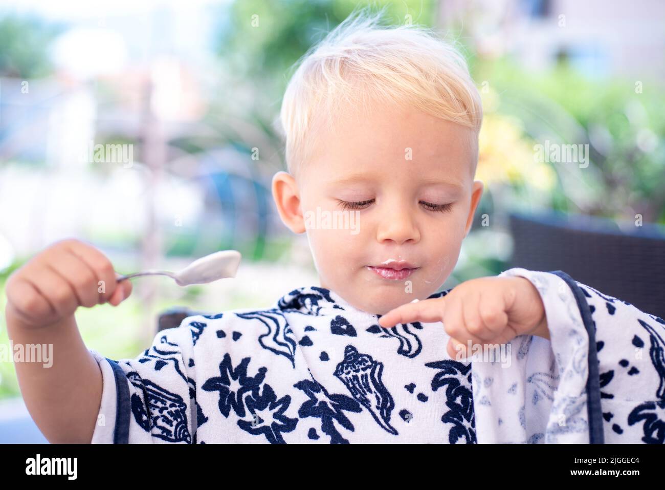 Kid eat healthy nutrition, baby food. Babies eating with spoon. Little ...