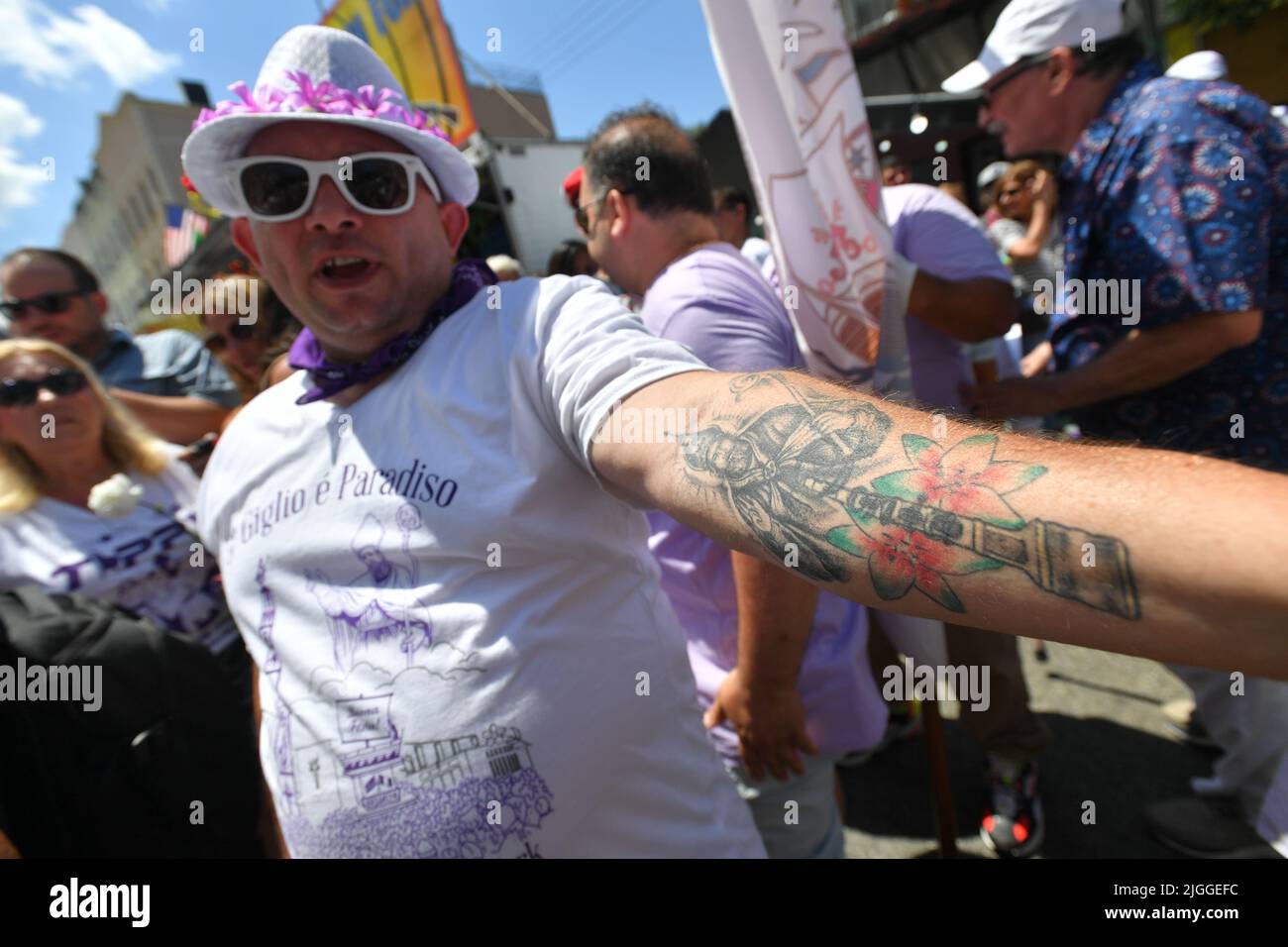 A man displays his tattoo of a Giglio during the annual Our Lady of ...