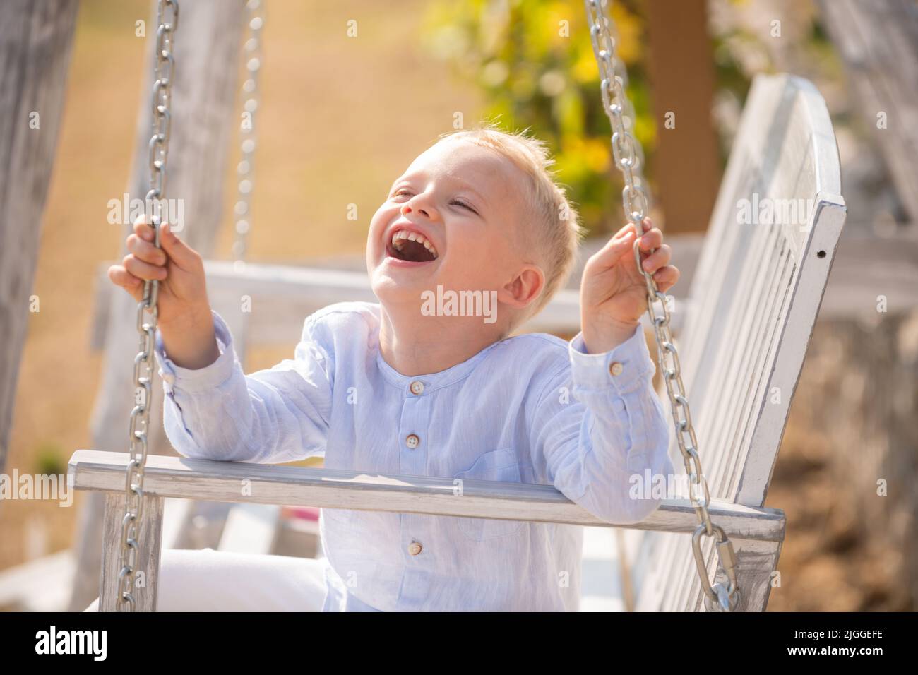 Spring kids portrait. Kid emotions concept. Portrait of young laughing boy outdoor. Happy child ...