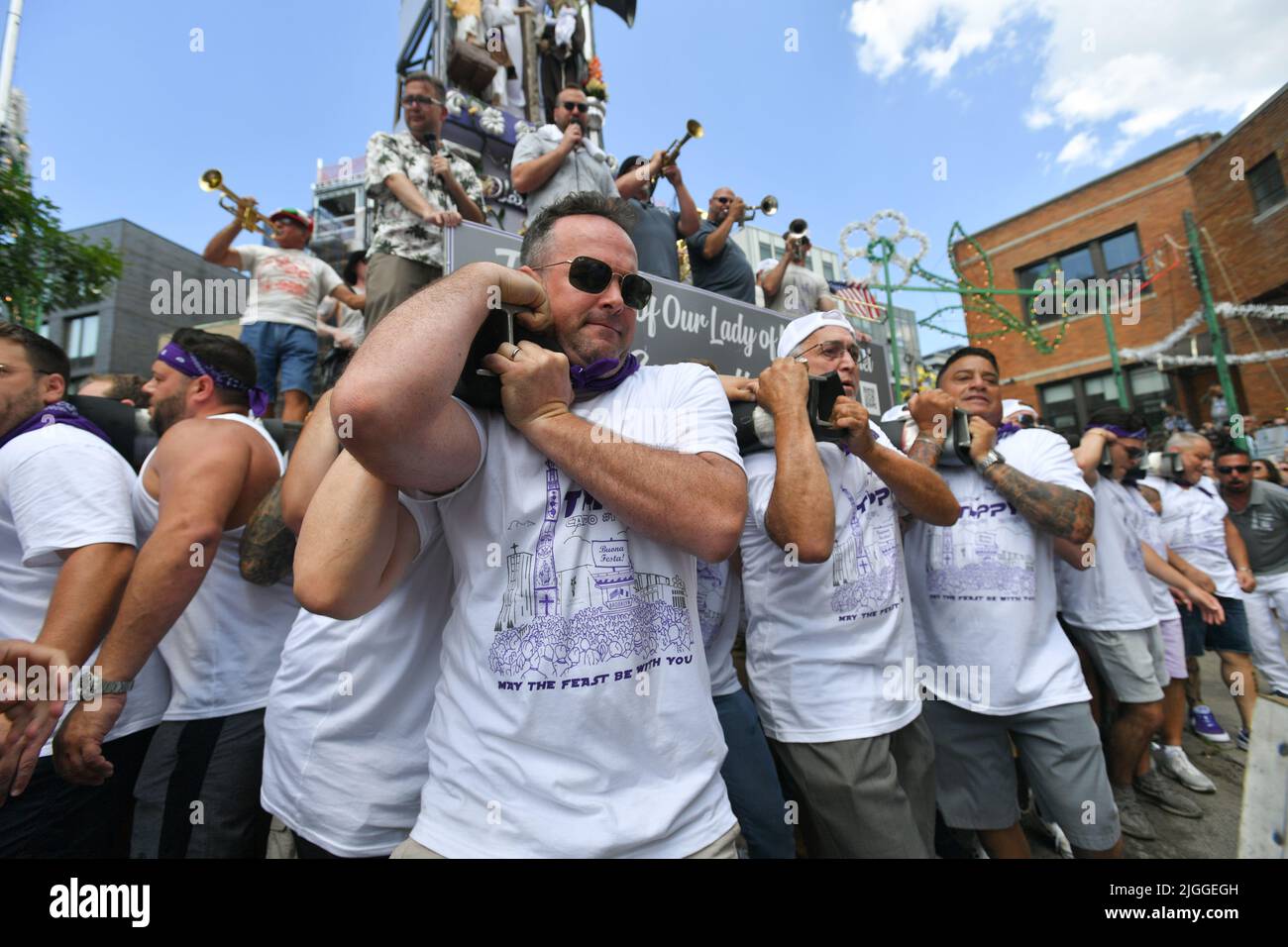 Attendants lift the Giglio during the annual Our Lady of Mount Carmel ...