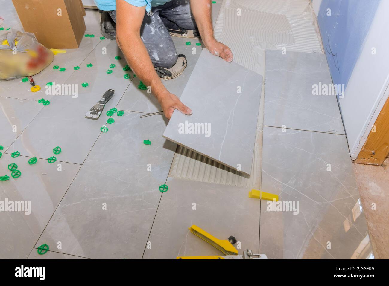 Installing ceramic floors hi-res stock photography and images - Alamy