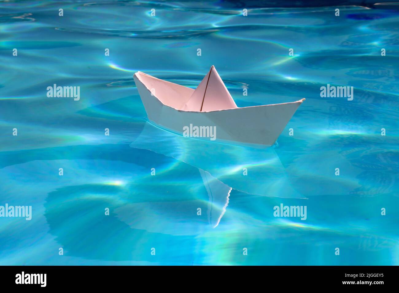 Cruise liner paper art. Paper boat sailing away on sea surface water ...