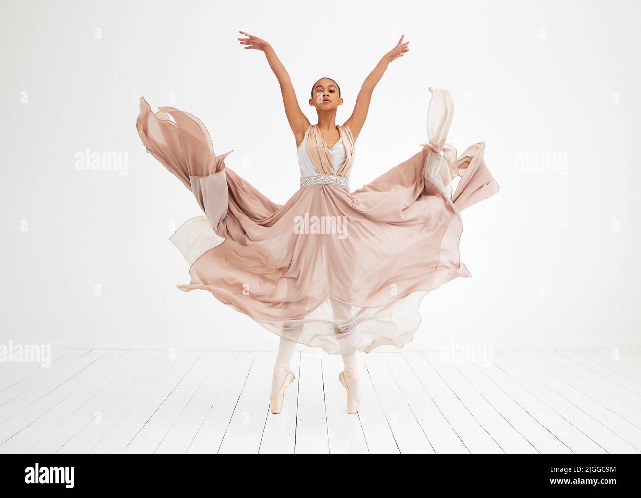 Where the magic happens. Full length shot of an attractive young female ...