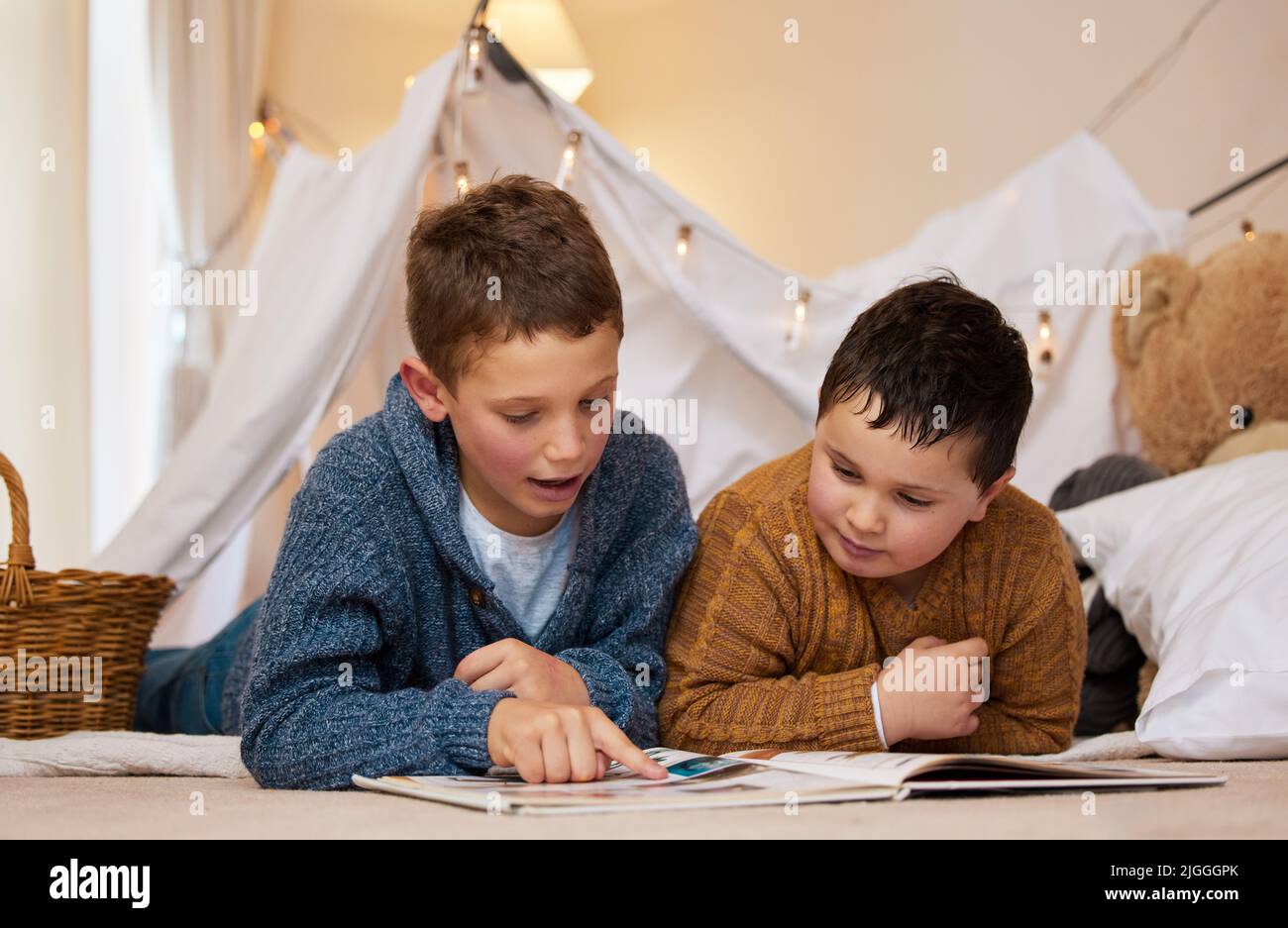 These little boys really enjoy story time together. two brothers ...