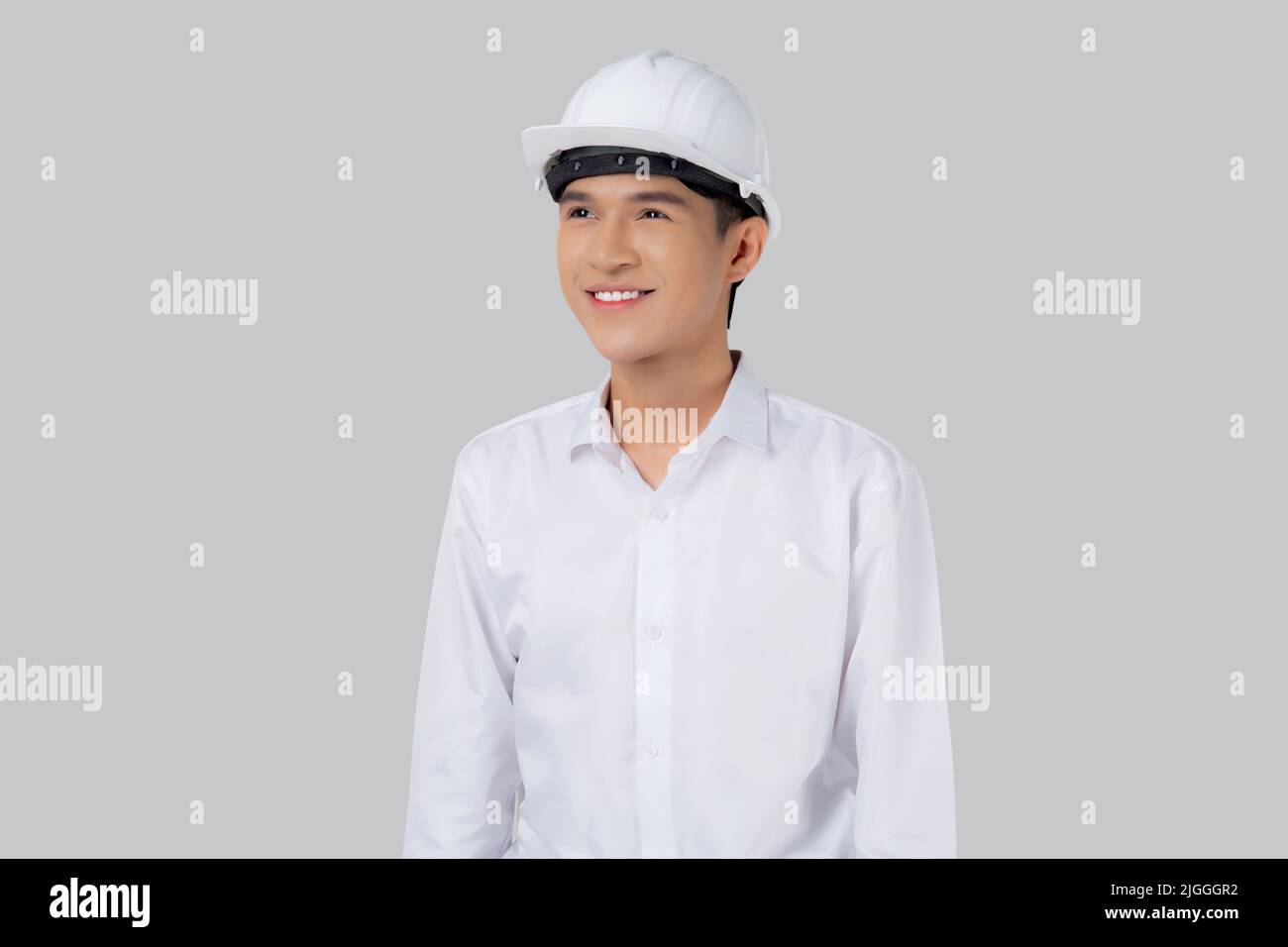 Portrait young asian man is engineer wearing helmet standing and ...