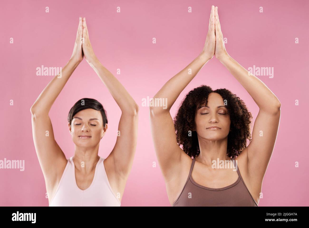 Finding their zen. two attractive young female athletes meditating in ...