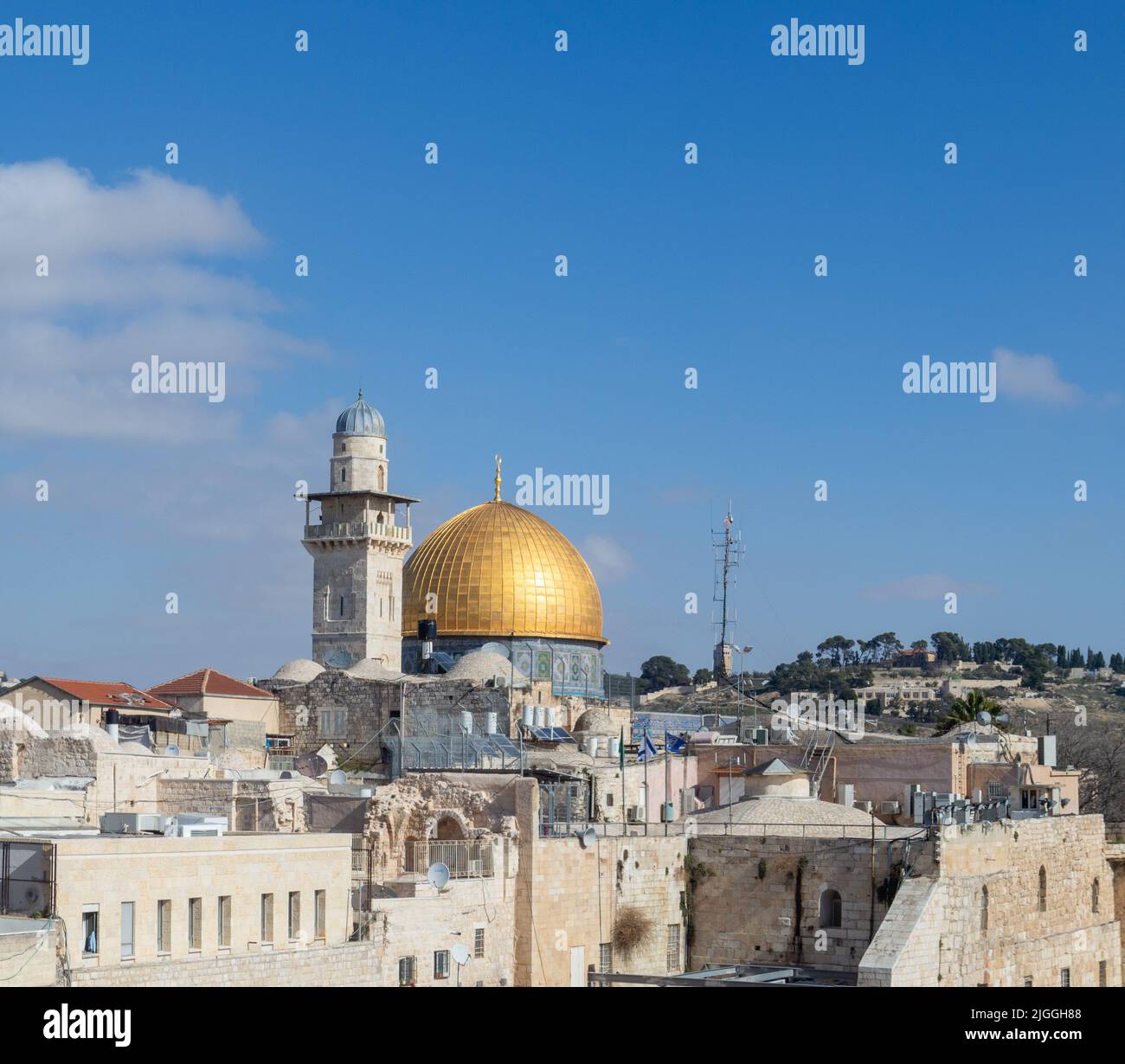 The Dome of the Rock in Jerusalem under a bright blue sky with smoky ...