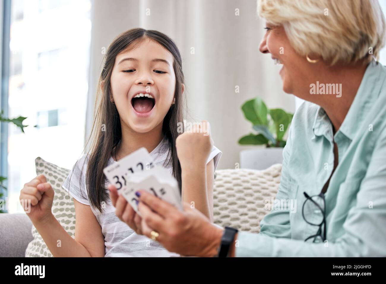 Shes acing her time tables. a little girl and her grandmother playing ...