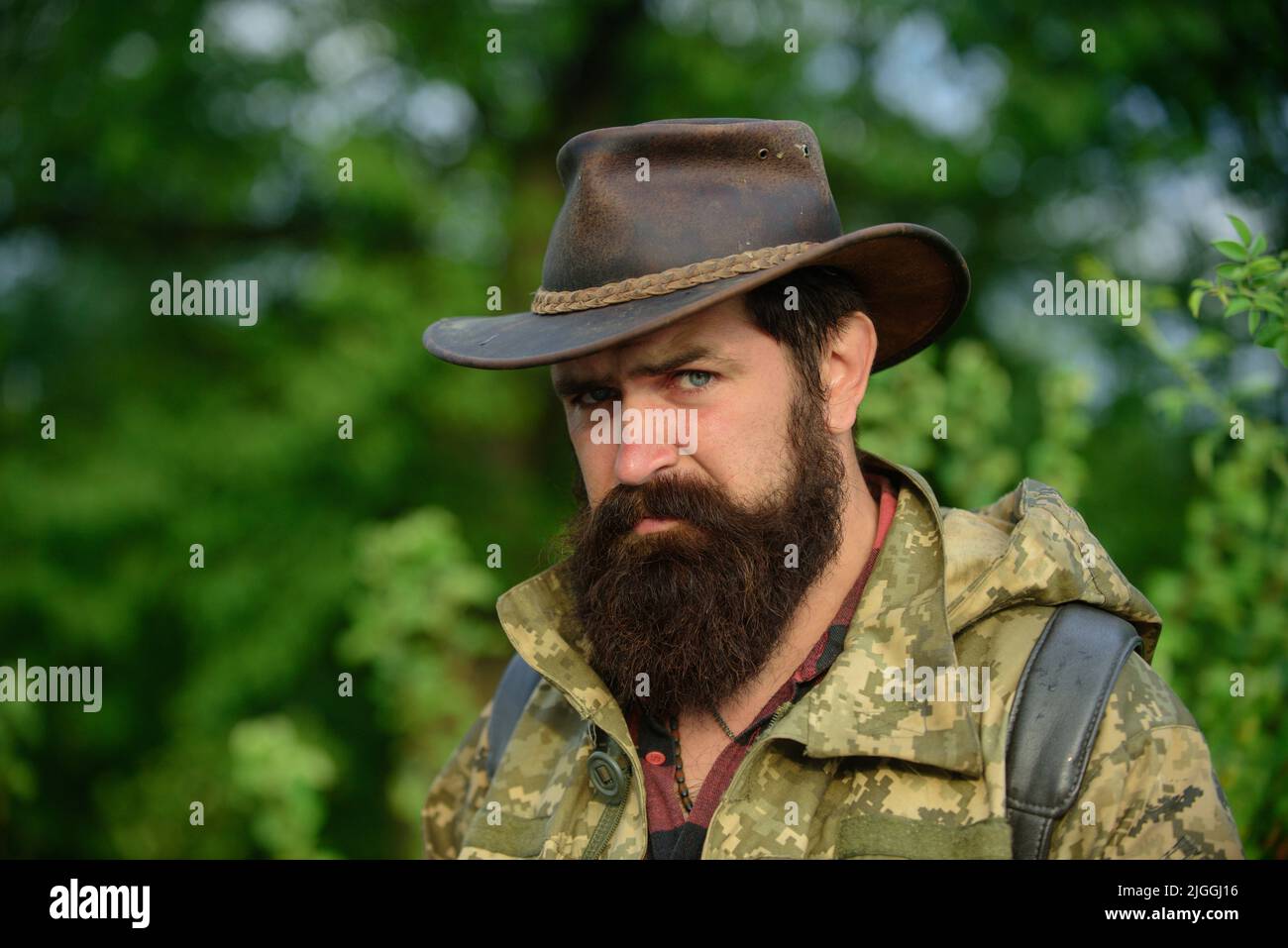 Portrait of adventure serious man extreme explorer. Man hunter in ...