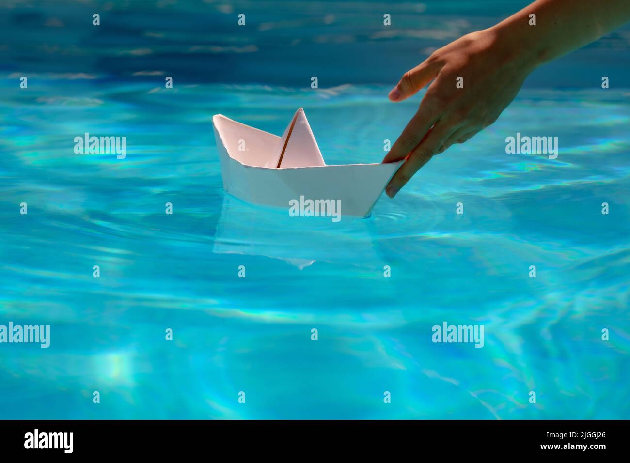 Paper ship in hand ready to sail. Tourism and traveling, travel dreams ...