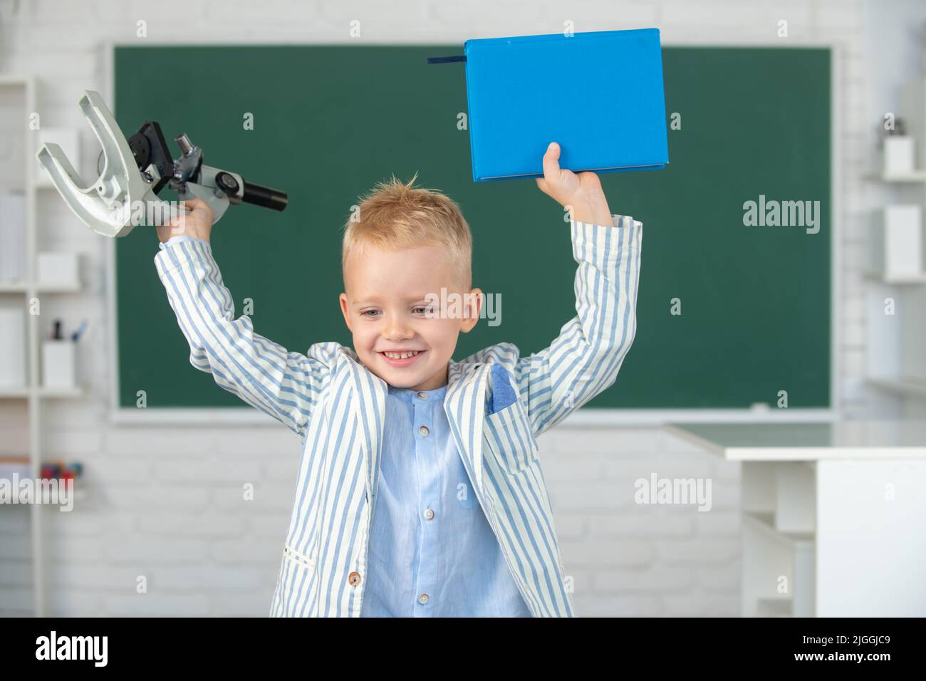 School boy studying math on lesson in classroom at elementary school ...